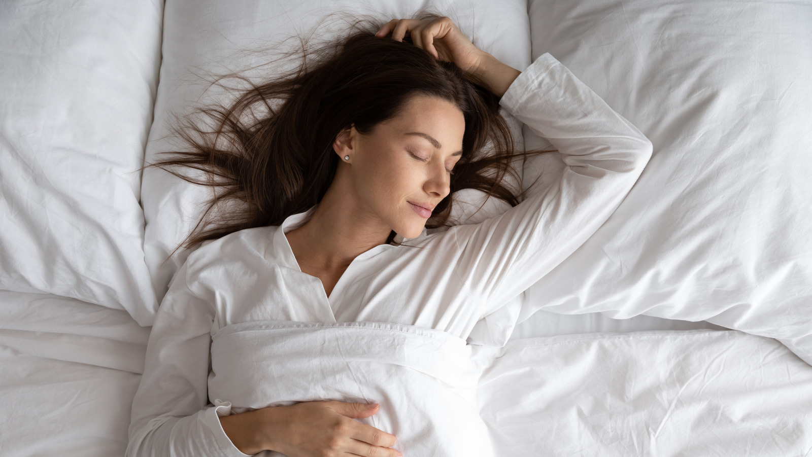 What It Really Means When You Dream About Hooking Up With Someone